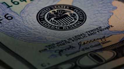 Fed Revises Growth and Inflation Forecasts, Holds Rates